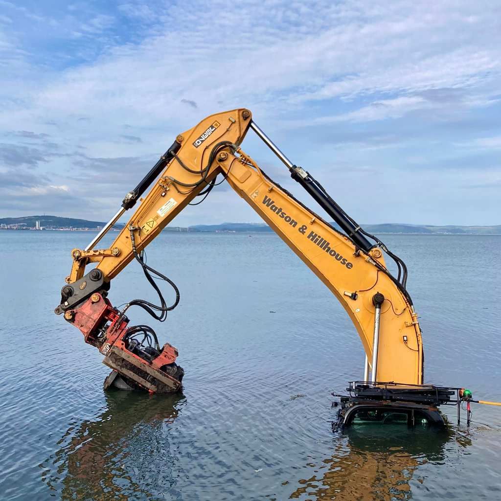 Excavator working on Mumbles sea defences left submerged after ...