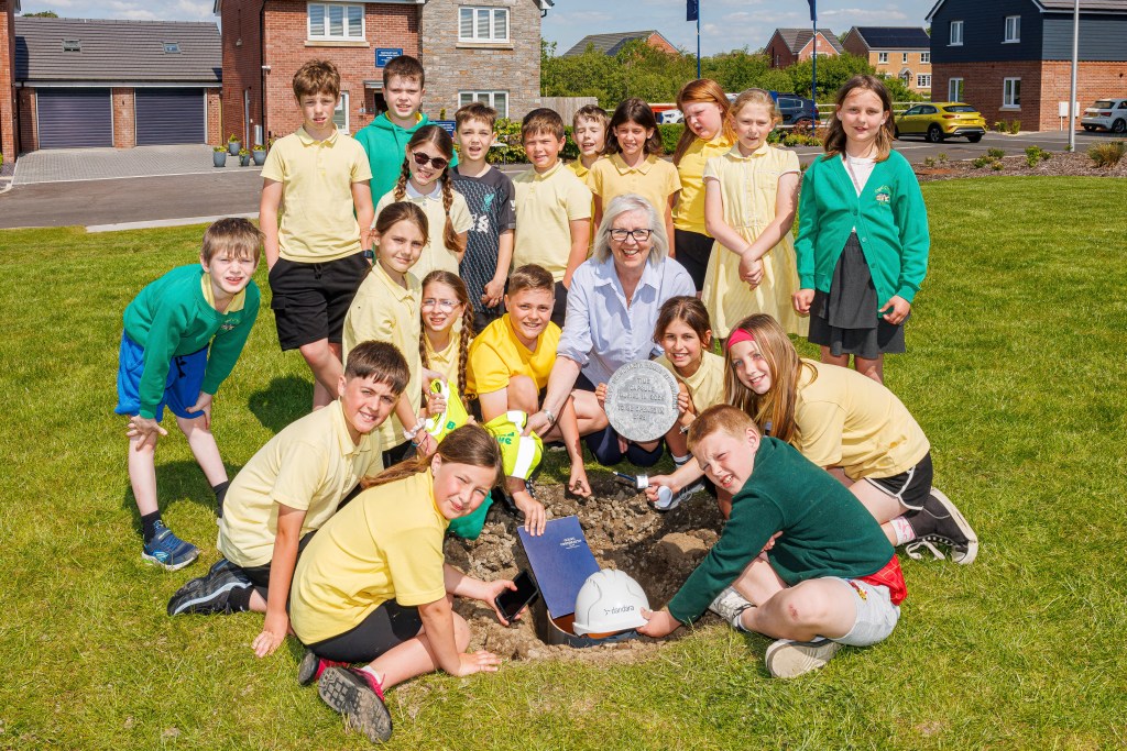 School bury time capsule at nearby housing development to mark 80th ...
